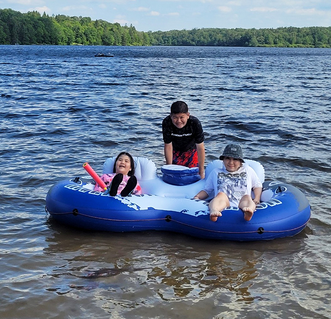 Family memories being made in real-time on Promised Land Lake. That inflatable raft&mdash;the unofficial throne of summer vacation royalty.