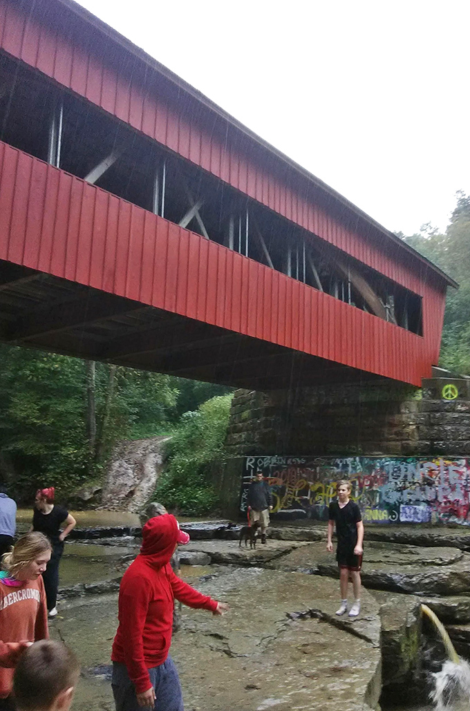 Local swimming hole or natural spa? The bridge provides shade while adventurous visitors cool off in Jonathan Creek's refreshing waters.