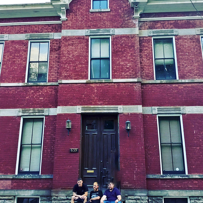 The rectory welcomes visitors brave enough to sit on its doorstep. That weathered entrance has seen more comings than goings, if you catch my drift.