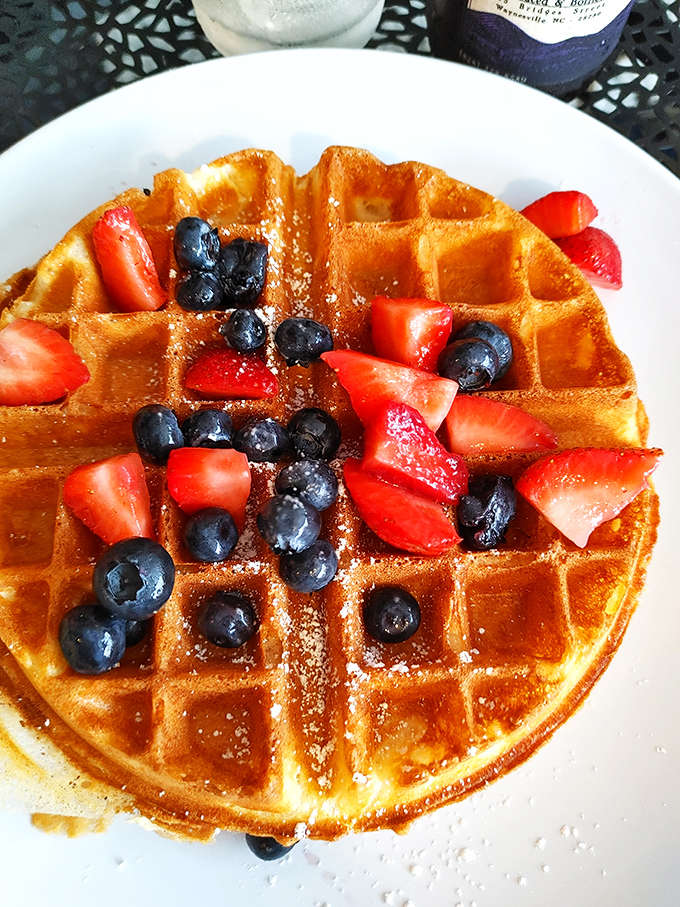 Golden waffle perfection crowned with fresh berries &ndash; nature's candy making a perfectly acceptable breakfast that somehow feels both virtuous and indulgent.