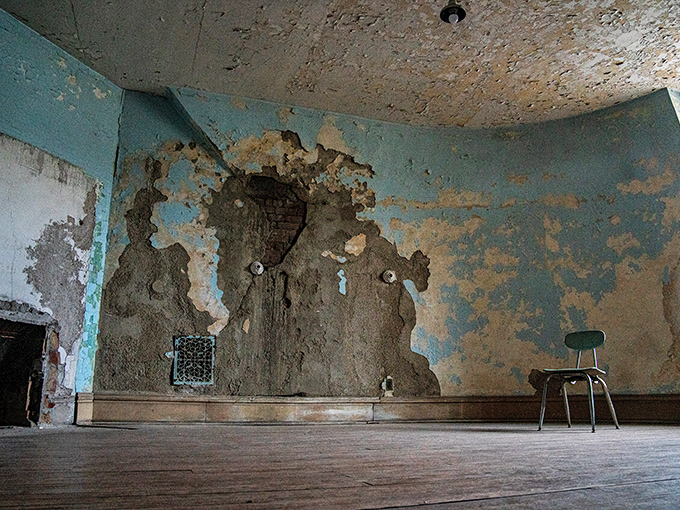 These walls have more layers than a Tolstoy novel, each paint chip revealing another decade of institutional optimism.