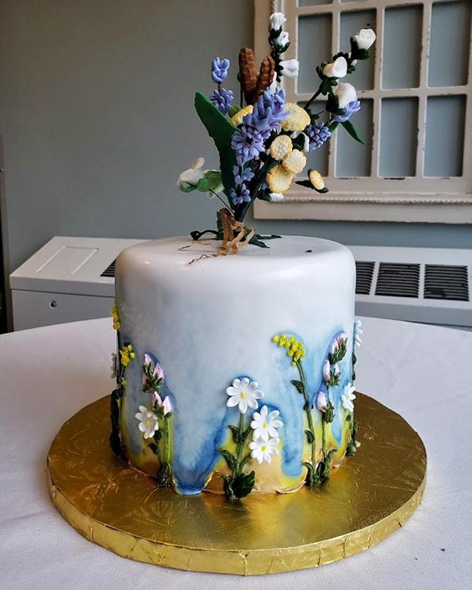 This wedding cake isn't just beautiful &ndash; it's botanical wizardry. Those flowers look so real you'd swear they were plucked from an enchanted garden.