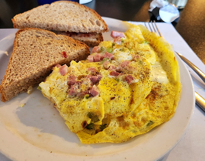 This Western Omelet isn't trying to reinvent breakfast; it's just perfecting it with perfectly diced ham and that golden cheese pull.