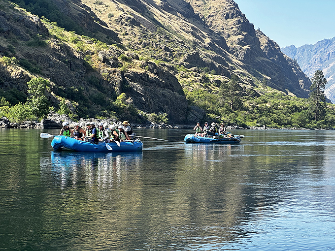 River rafting through canyon walls that make skyscrapers look like Lego blocks. Nature's rollercoaster comes with complimentary splashes.