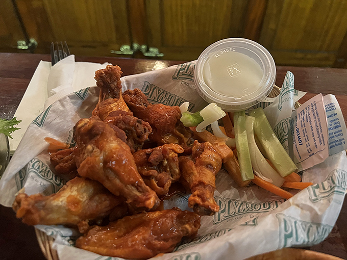 Behold the golden beauties that launched a thousand road trips &ndash; perfectly sauced wings with celery soldiers standing guard.