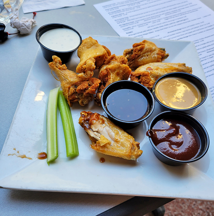 These wings don't just come with multiple sauces&mdash;they come with a silent guarantee that you'll be planning your next visit before the last bite.