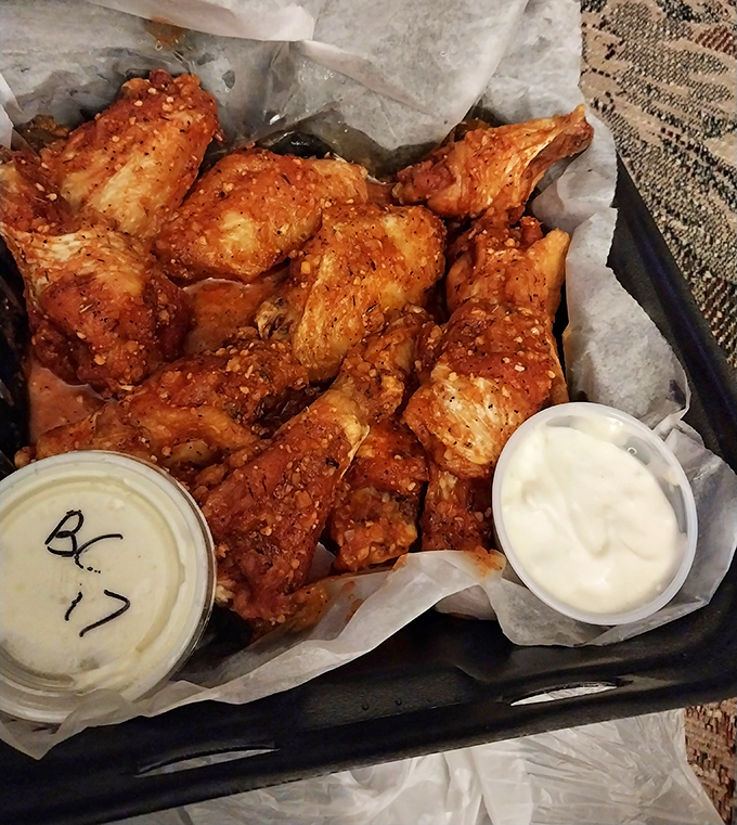 These wings aren't just cooked, they're transformed—crispy, glistening with sauce, and arranged like a delicious mosaic of poultry perfection.