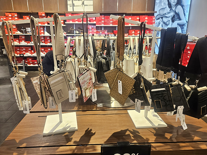 Designer handbags standing at attention like elegant soldiers. That Michael Kors tote is practically begging to come home with you.