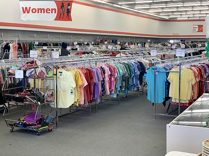 Rainbow-organized racks stretch endlessly, proving that one person's "I'm over it" is another's "I need it."