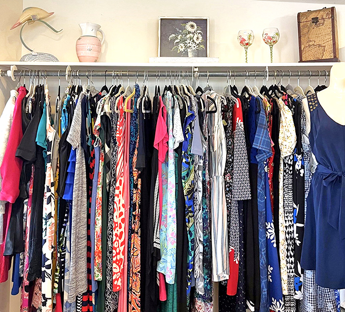 The clothing racks tell stories spanning decades of fashion. Someone's "what was I thinking?" moment becomes your vintage statement piece.