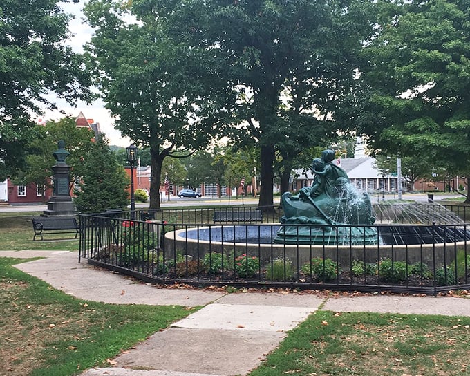 History and nature embrace in Wellsboro's central park, where monuments honor the past while seasonal colors celebrate the present.