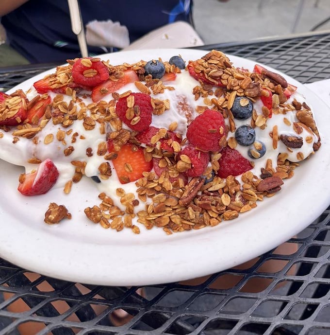 A mountain of yogurt, granola, and berries that makes you question why anyone would ever skip breakfast.