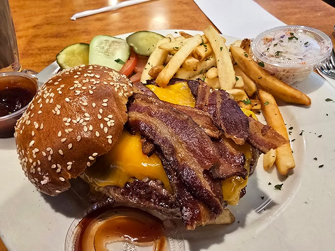 This isn't just a bacon cheeseburger; it's architecture with attitude. The melted cheese cascading over those crispy bacon strips is practically showing off.