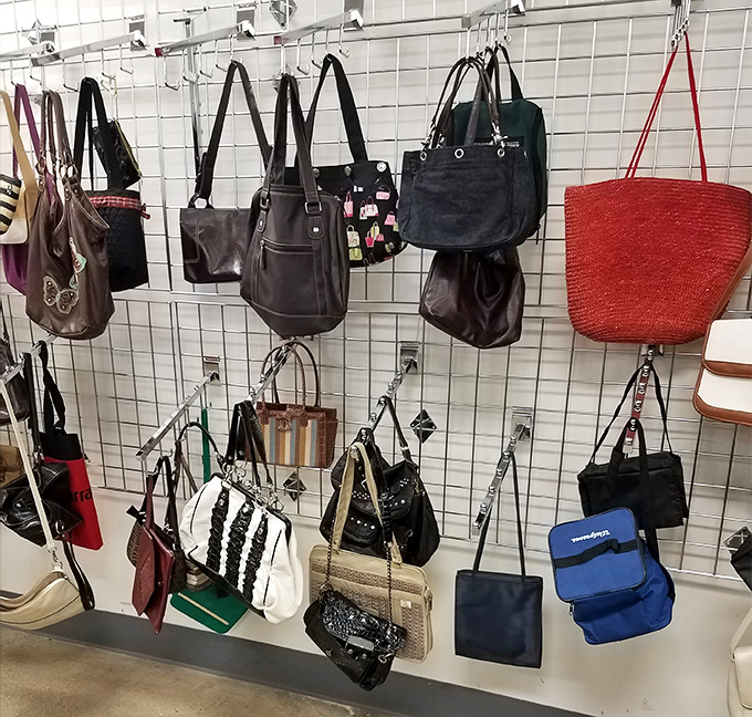 The handbag wall &ndash; where yesterday's designer splurges become today's incredible finds. That red tote is practically screaming your name.