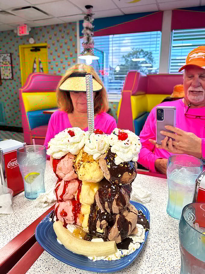 Not so much a dessert as a skyscraper of joy. This banana split defies both gravity and restraint, with ice cream scoops stacked higher than my retirement dreams. 