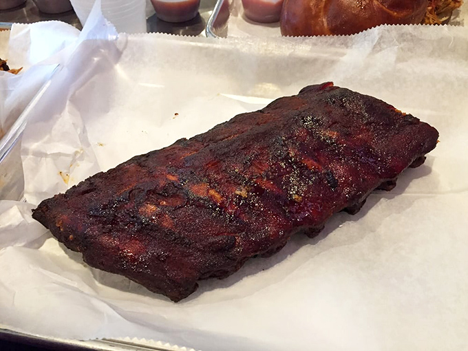 These ribs don't just fall off the bone &ndash; they practically leap into your mouth, sporting a bark so perfect it deserves its own appreciation society.