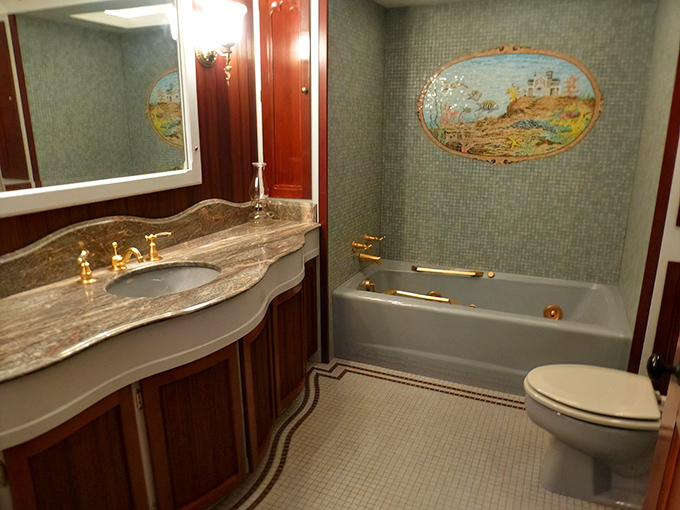 Victorian bathroom luxury that would make your great-grandmother swoon. That mosaic mural beside the tub transforms mundane bathing into an artistic experience.