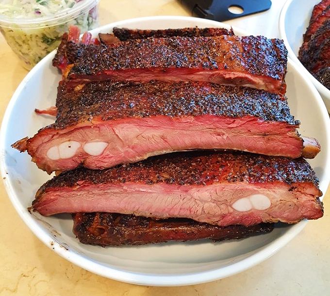 Behold the crown jewel: ribs so perfectly smoked they practically fall off the bone with anticipation.