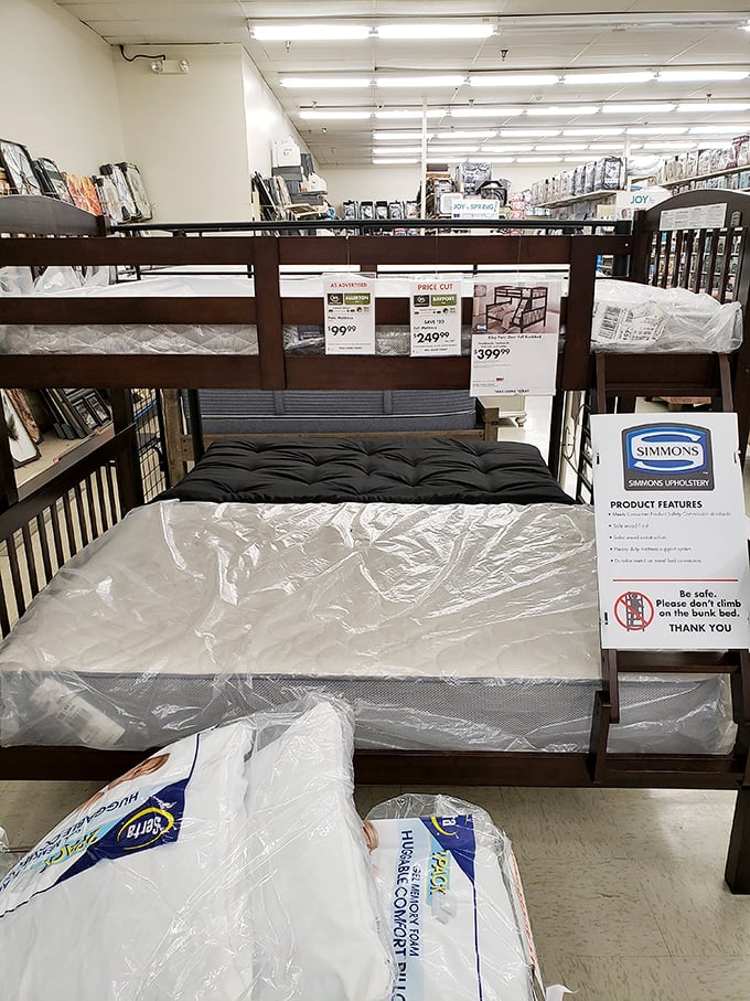 Bunk beds and mattresses stand at attention, ready to outfit dorm rooms and first apartments without the financial commitment of fancy furniture stores.