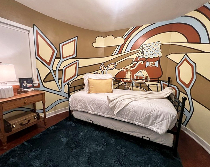 That mural transforms sleep into a storybook adventure where dreams come with their own illustrated soundtrack.