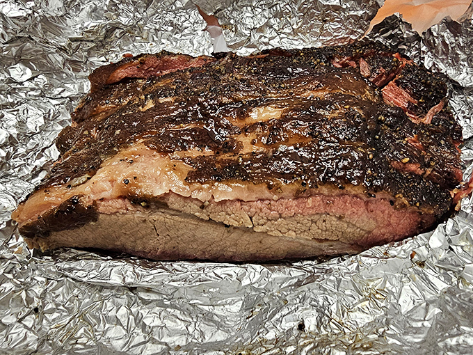 Behold the brisket &ndash; a glistening monument to patience where smoke and time transform tough meat into something so tender it practically whispers your name.