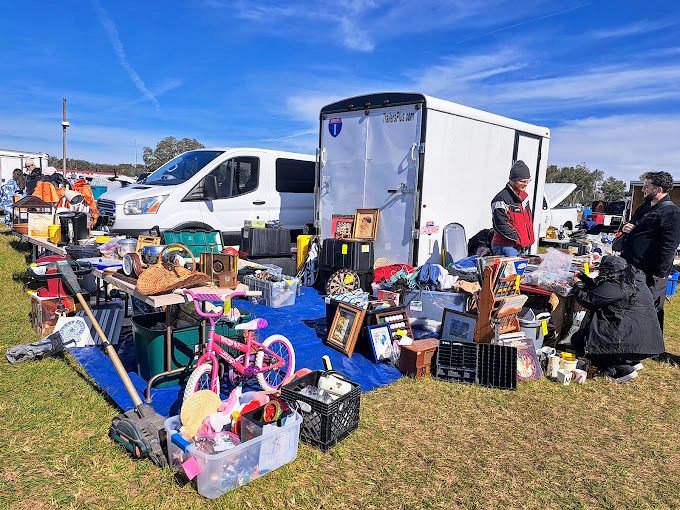 Childhood nostalgia meets practical necessity. From pink bicycles to household essentials, this vendor's eclectic collection mirrors the market's delightful unpredictability.