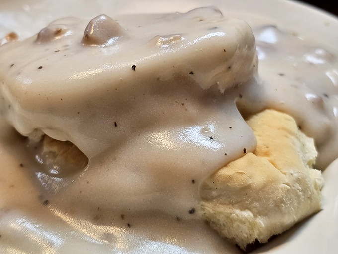 Behold the holy grail &ndash; biscuits and gravy so good you'll want to write home about it. That pepper-speckled gravy blankets the biscuit like a warm hug from your favorite aunt.