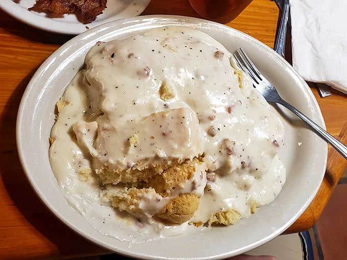 Biscuits and gravy nirvana! This plate doesn't just satisfy hunger &ndash; it creates memories with every pepper-flecked, sausage-studded, velvety bite.