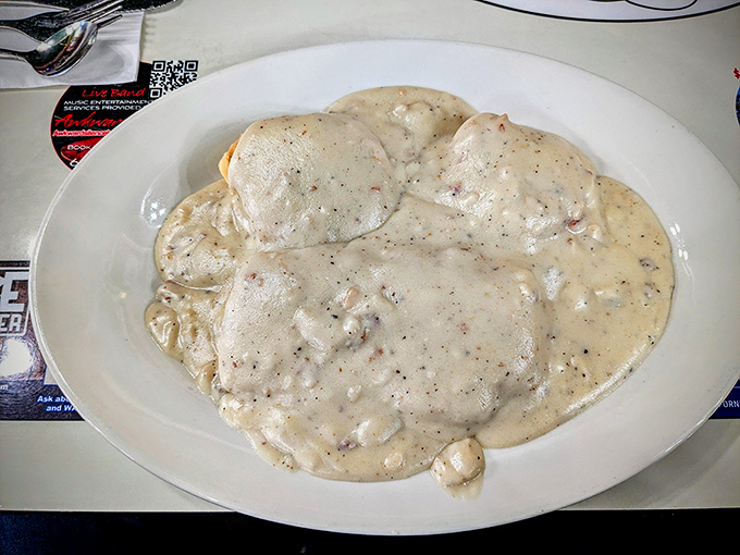 Biscuits and gravy that doesn't just smother&mdash;it embraces. This plate isn't a meal, it's a warm hug from your grandmother's kitchen.
