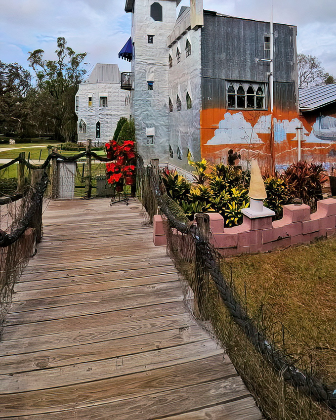 The wooden boardwalk leads visitors across the moat, proving that even in Florida, castle approaches demand proper medieval credentials.