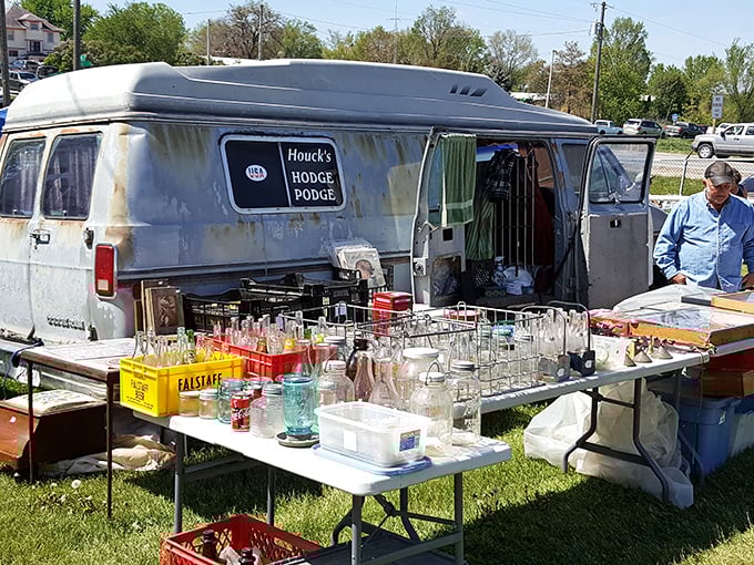 Vintage glassware displayed from a well-traveled van&mdash;proof that the best antique shops sometimes come with wheels and stories from the road.