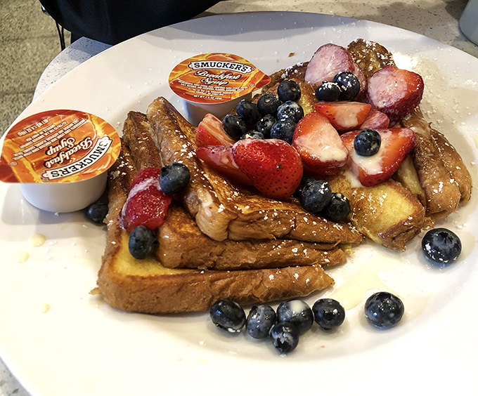 French toast that's dressed for success! Fresh berries and powdered sugar transform ordinary bread into a breakfast worthy of your weekend splurge.