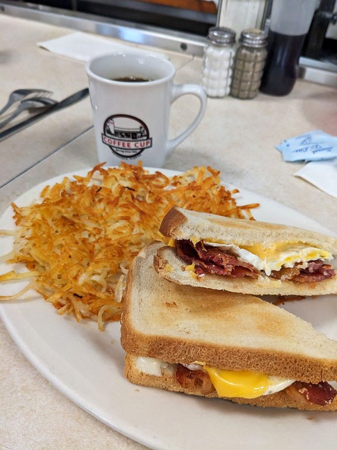 4. breakfastBreakfast sandwich perfection: golden toast, melty cheese, crispy bacon, and a perfectly cooked egg, with hash browns that could make a potato farmer weep with joy.