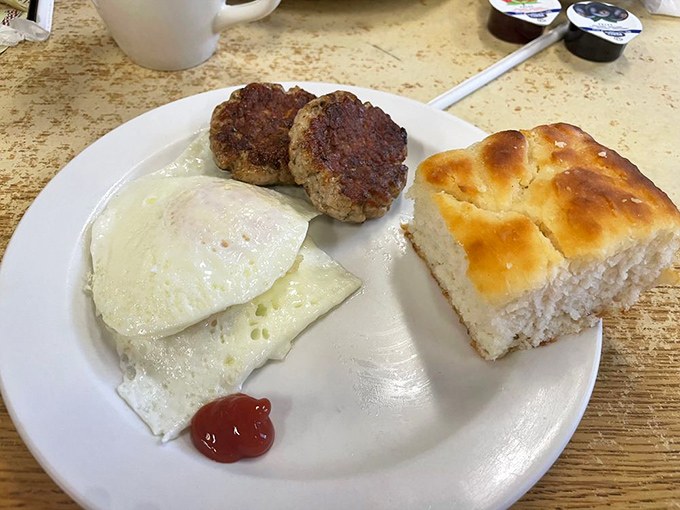 Simple perfection on a plate: eggs, housemade sausage patties, and a biscuit that could make your grandmother jealous. Breakfast doesn't need to be complicated to be extraordinary.