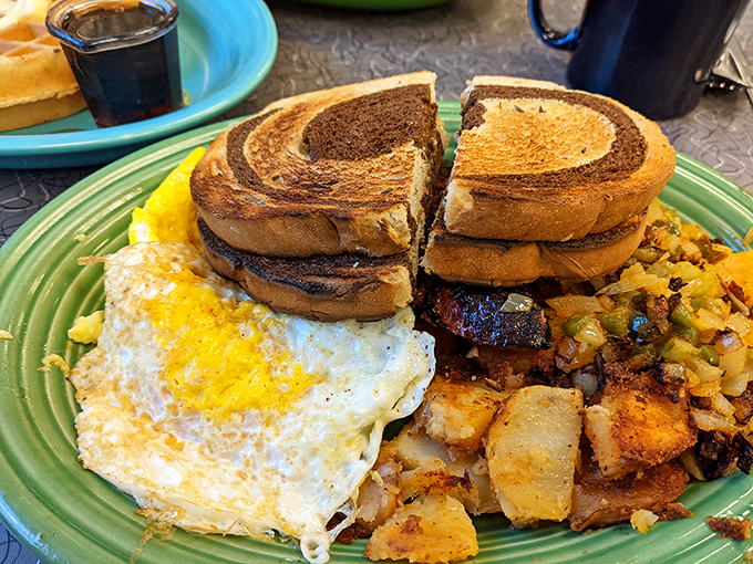 Breakfast perfection on a plate: golden toast, farm-fresh eggs, and home fries that have clearly been shown the proper respect on the griddle.