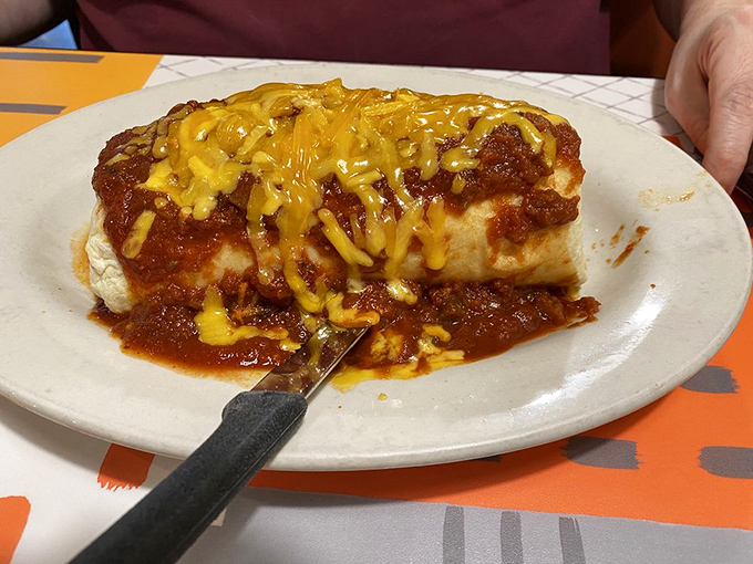 This burrito isn't just wrapped&mdash;it's embraced by a tortilla and smothered with enough cheese and sauce to make your cardiologist wince. Worth it.