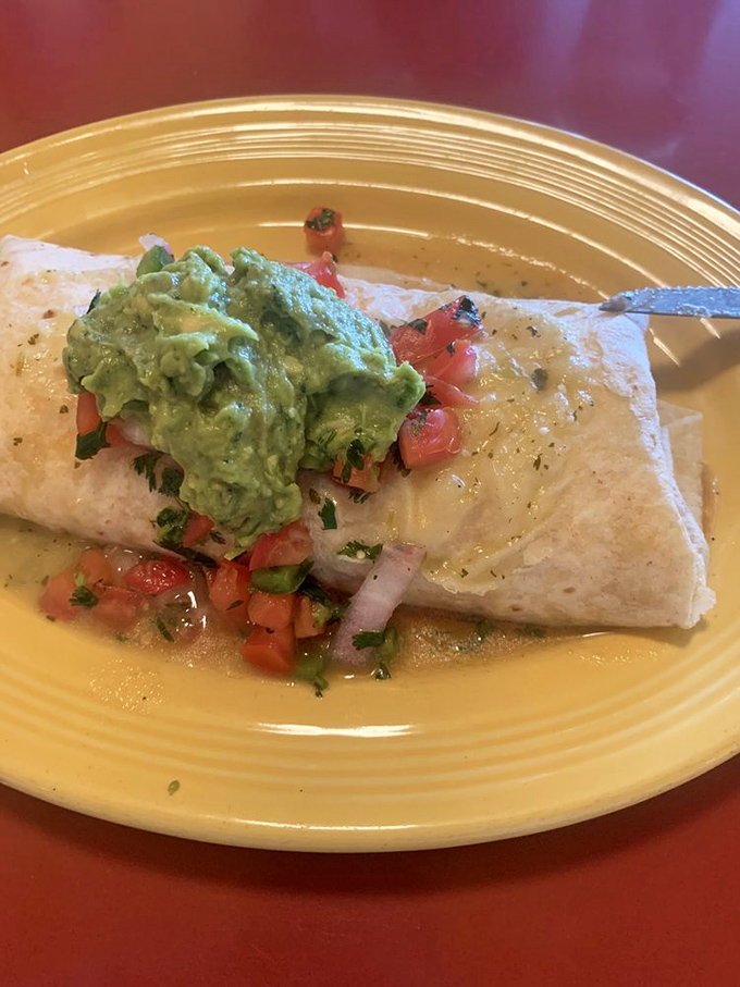 Breakfast burrito nirvana &ndash; a perfect package of morning bliss topped with fresh avocado that makes kale smoothies weep with inadequacy.