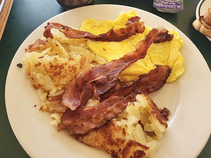 Breakfast nirvana achieved: golden hash browns with the perfect crisp-to-tender ratio, eggs that actually taste like eggs, and bacon that means business.