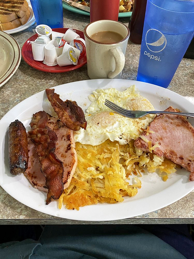 Breakfast doesn't whisper here; it announces itself with authority. The hash browns have achieved that mythical balance between crispy exterior and tender heart.