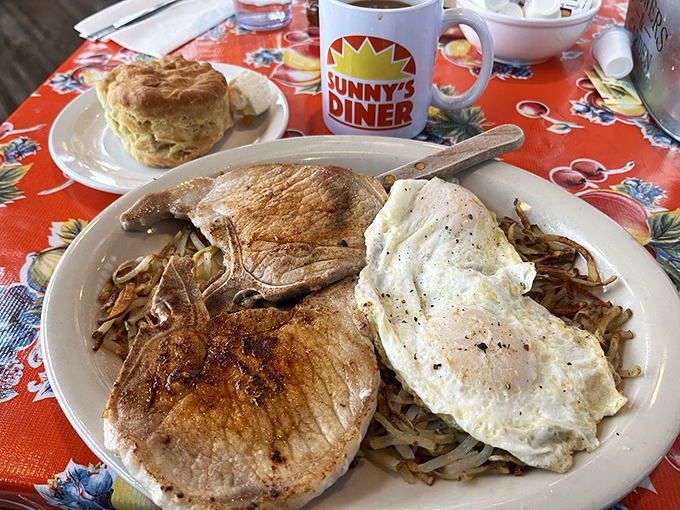 Breakfast alchemy at its finest: perfectly grilled ham steaks, eggs with just-right edges, and hash browns that crackle with each forkful.