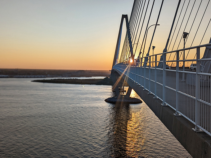 The Arthur Ravenel Jr. Bridge catches the day's final light, a modern marvel connecting Charleston to coastal escapes beyond.