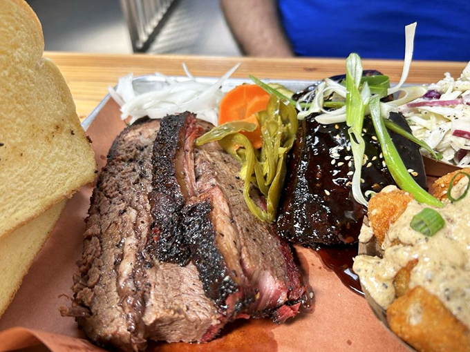 Brisket so tender it practically surrenders to your fork. That smoke ring is nature's way of saying "you've made the right choice."