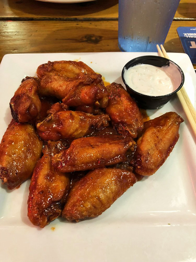 These buffalo wings aren't messing around &ndash; crispy, saucy, and demanding to be devoured with the kind of enthusiasm usually reserved for finding a parking spot at the beach.