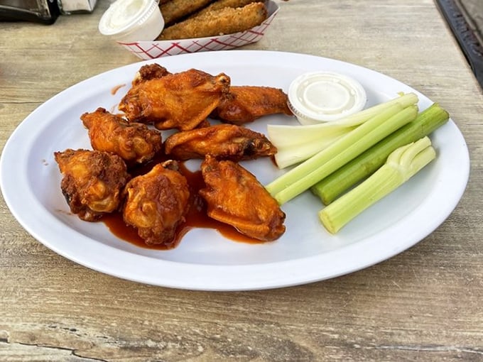 Buffalo wing perfection exists, and I've found it. That glistening sauce clings to each wing like it was made specifically for this moment.