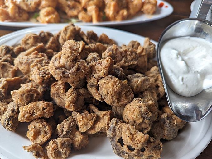 These aren't your average mushrooms&mdash;they're crispy, golden nuggets of happiness served with a cooling dip. Proof that sometimes the supporting acts deserve a standing ovation too.