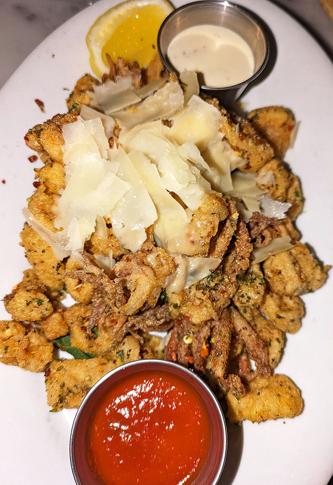 The legendary calamari that launched a thousand road trips&mdash;crispy, tender, and topped with shaved cheese that melts into seafood perfection.
