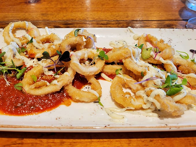Behold the star attraction: calamari that's crispy where it should be, tender where it matters, and artfully presented with bright marinara.
