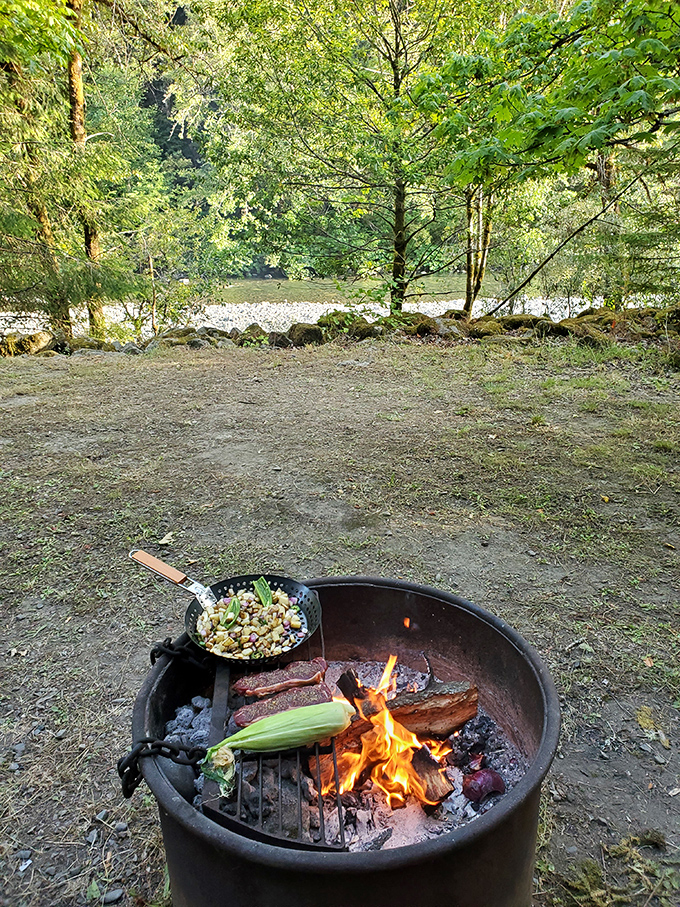 Dinner with a view! Nothing elevates campfire cooking like the soundtrack of a nearby river and the company of ancient trees.