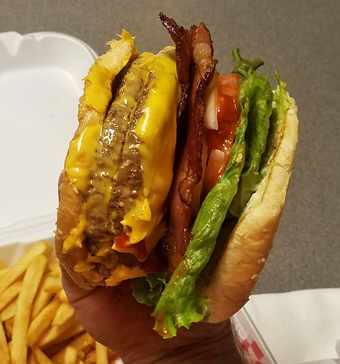 This isn't just a cheeseburger; it's edible architecture where each layer plays its part perfectly in the symphony of flavor.