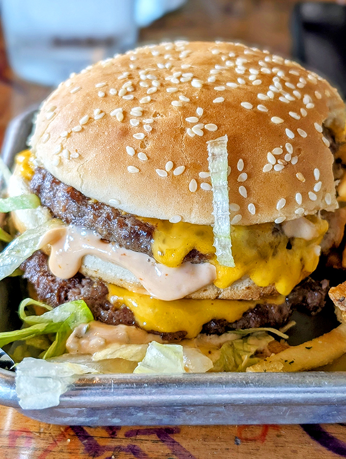 This isn't just a burger&mdash;it's an architectural marvel of beef, cheese, and special sauce that requires both hands and possibly a bib.